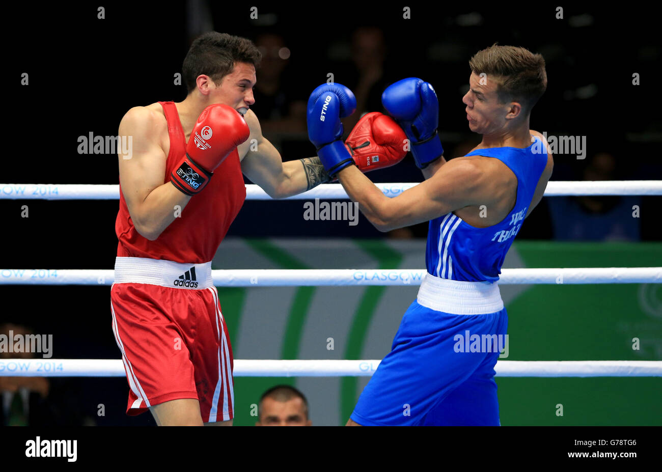 Wales' Nathan Thorley (blue) in action against Tonga's Benjamin Taualii ...