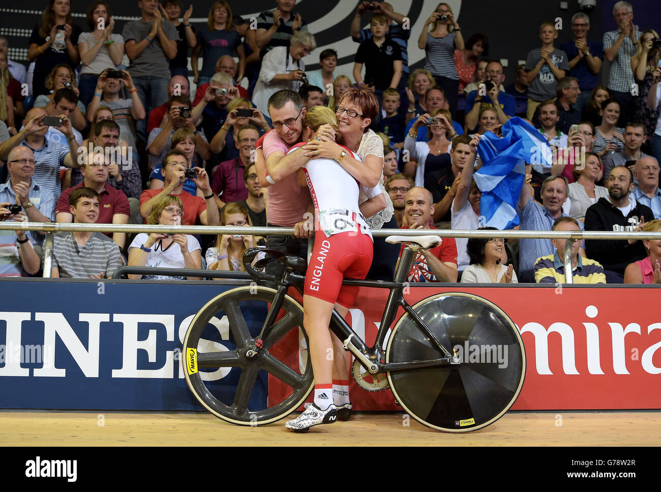 England's Laura Trott hugs her parents Glenda and Adrian after taking ...