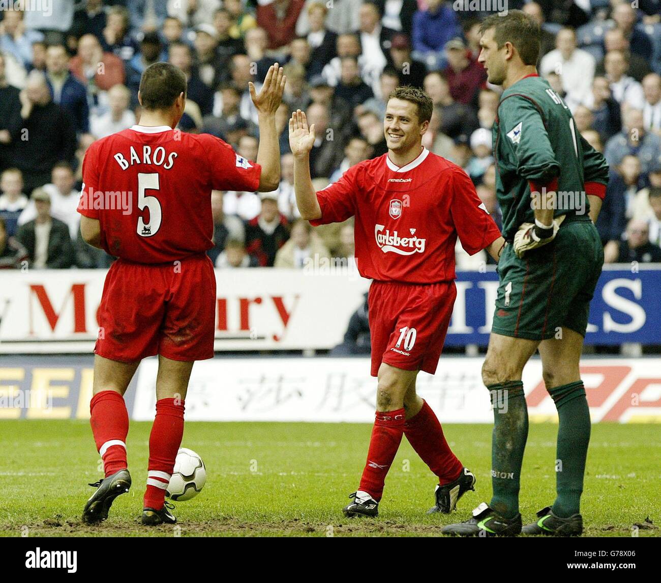 Liverpool's Michael Owen (centre) celebrates scoring the 3rd goal with ...