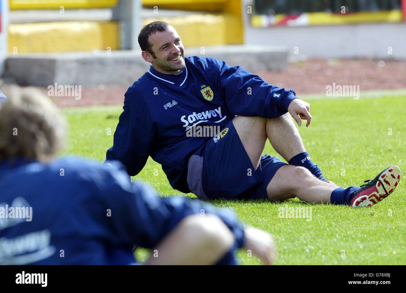 Scotland's Colin Cameron stretches during a team training session at ...