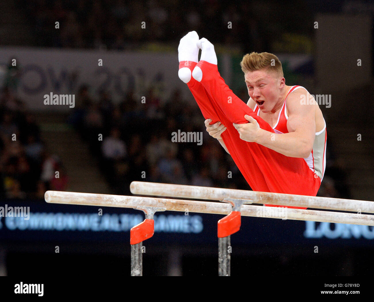 England's Nile Wilson competes on the parallel bars during the Men's ...