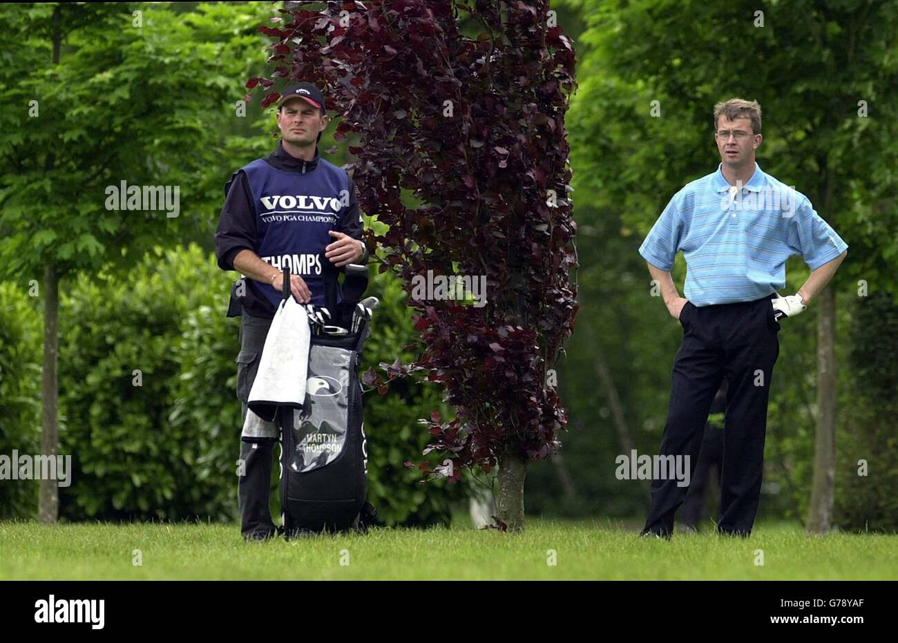 England's Martyn Thompson (right) prepares to play his second shot out ...