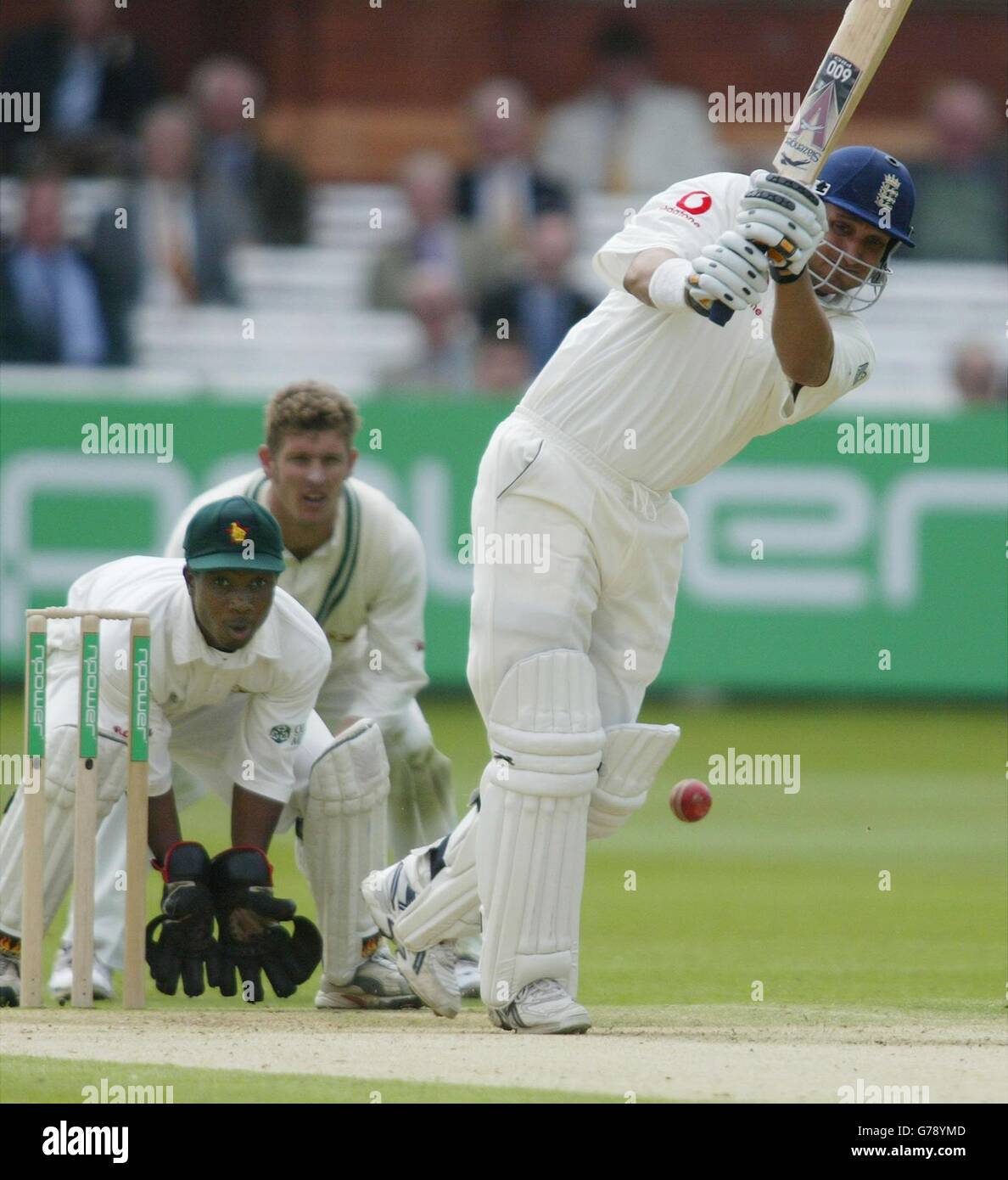 England batsman Mark Butcher hits a ball from Zimbabwe's Raymond Price ...