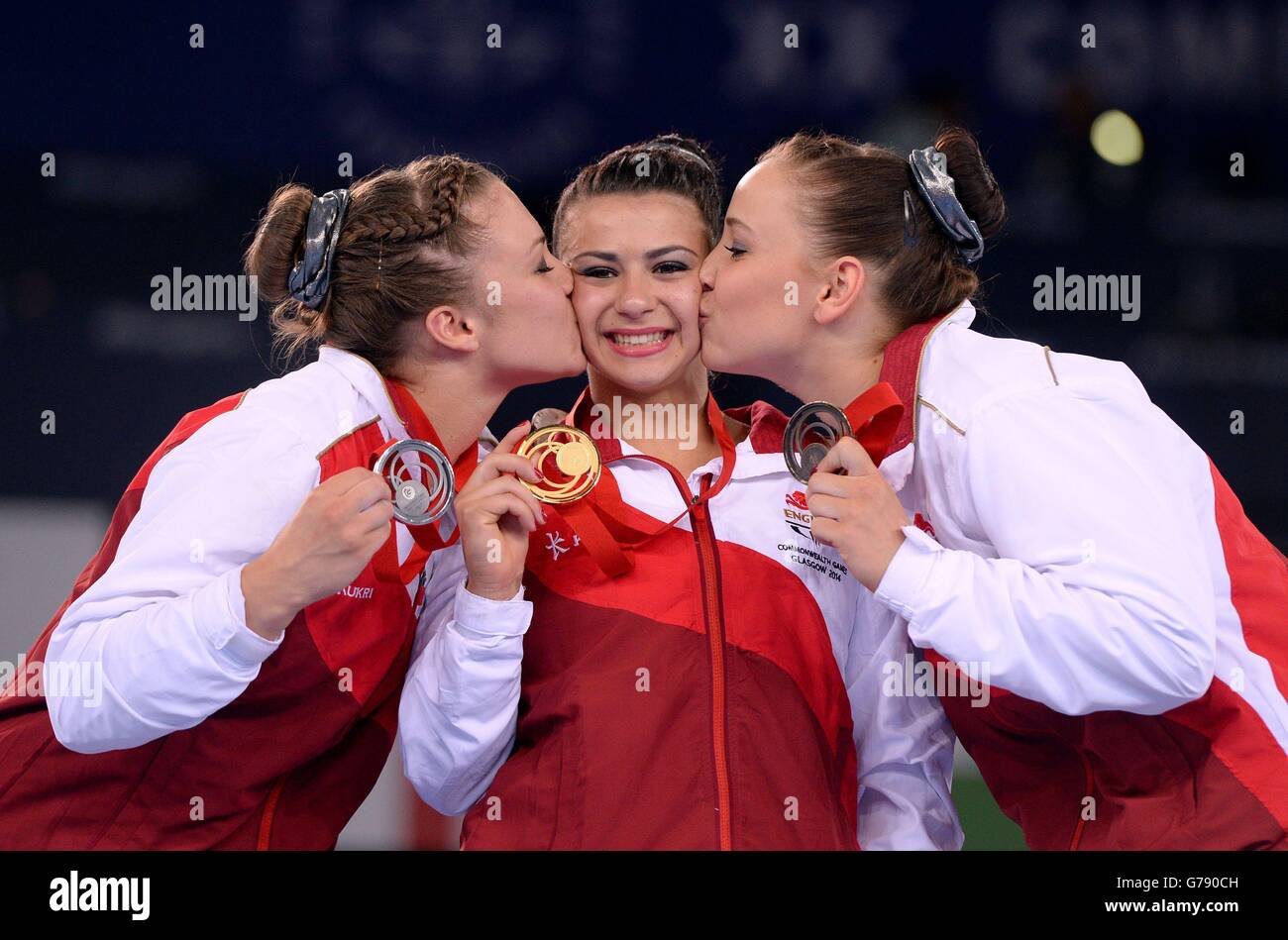 England's Claudia Fragapane (Gold Medal) is kissed by compatriots Ruby ...