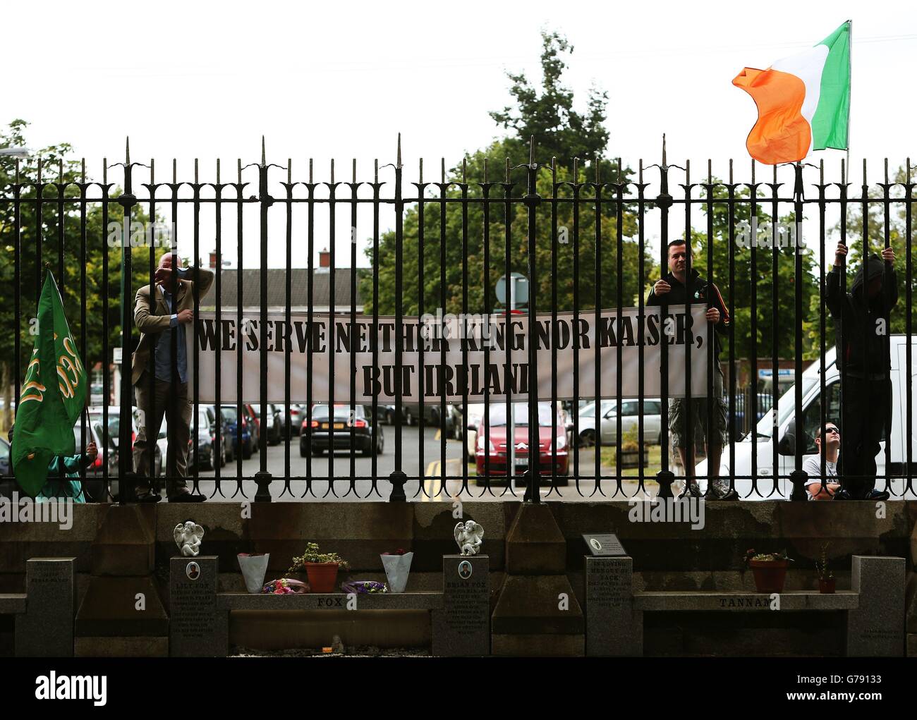 Protersters hang a banner on the fence of Glasnevin cemetery ahead of ...