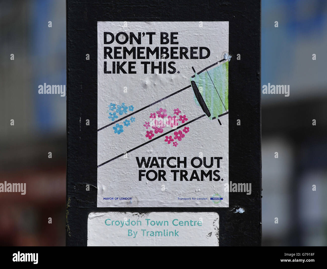 Croydon tram - stock. A warning sign on a post for Tramlink trams in ...