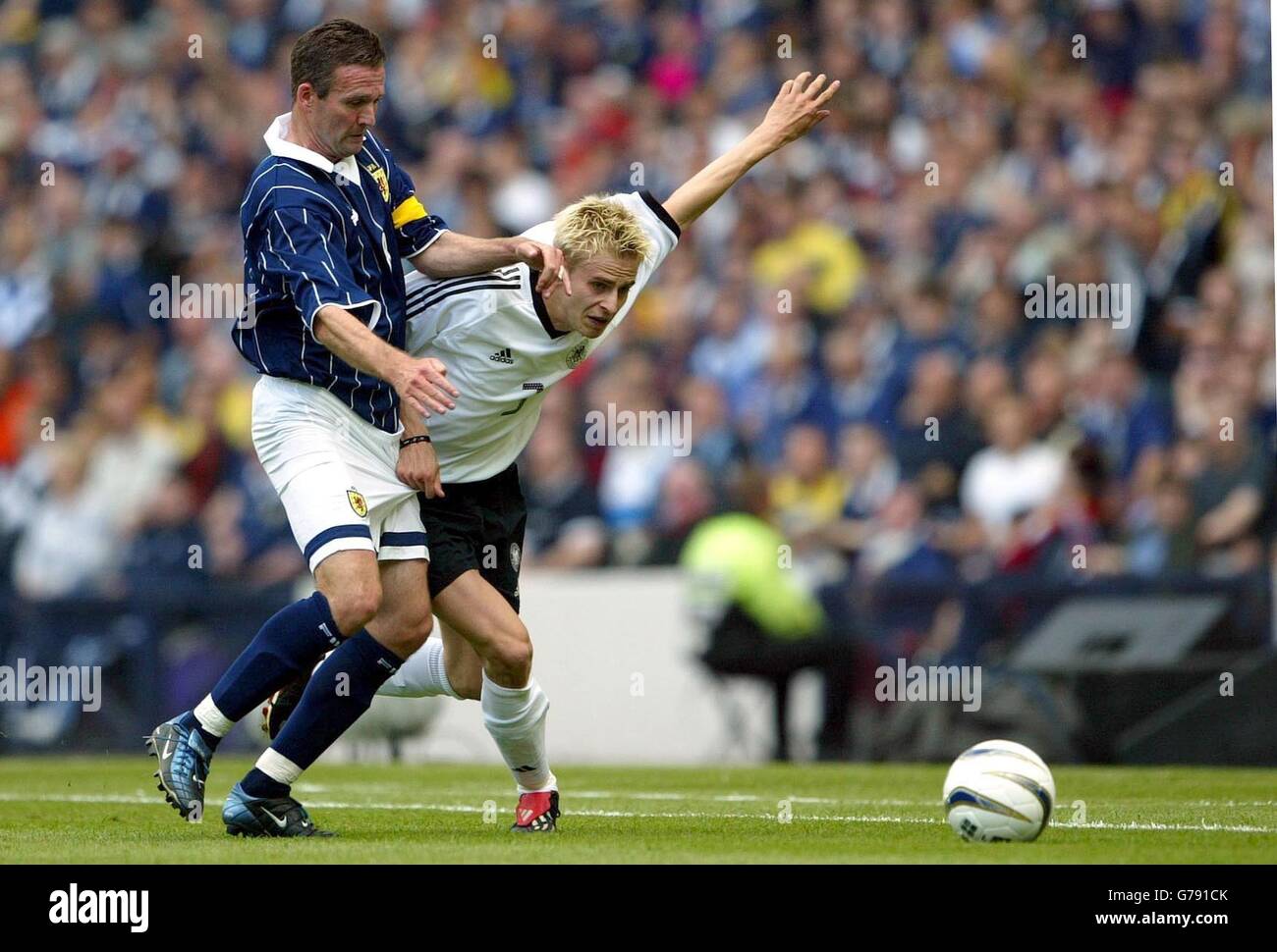 Scotlands Paul Lambert (left) with Tobias Rau of Germany, during the ...