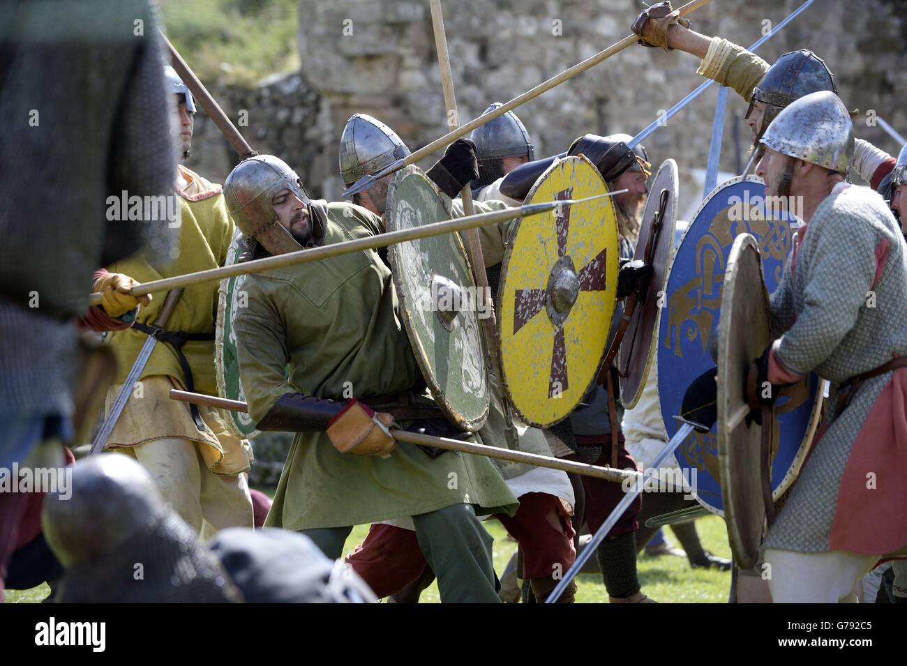 A re-enactment of a Viking attack takes place at Lindisfarne Priory ...