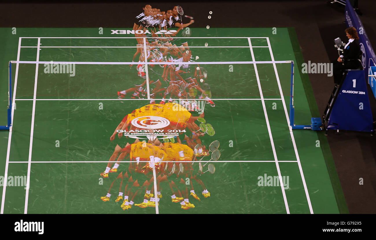 multiple exposure An umpire views the Men's Doubles Badminton Gold ...