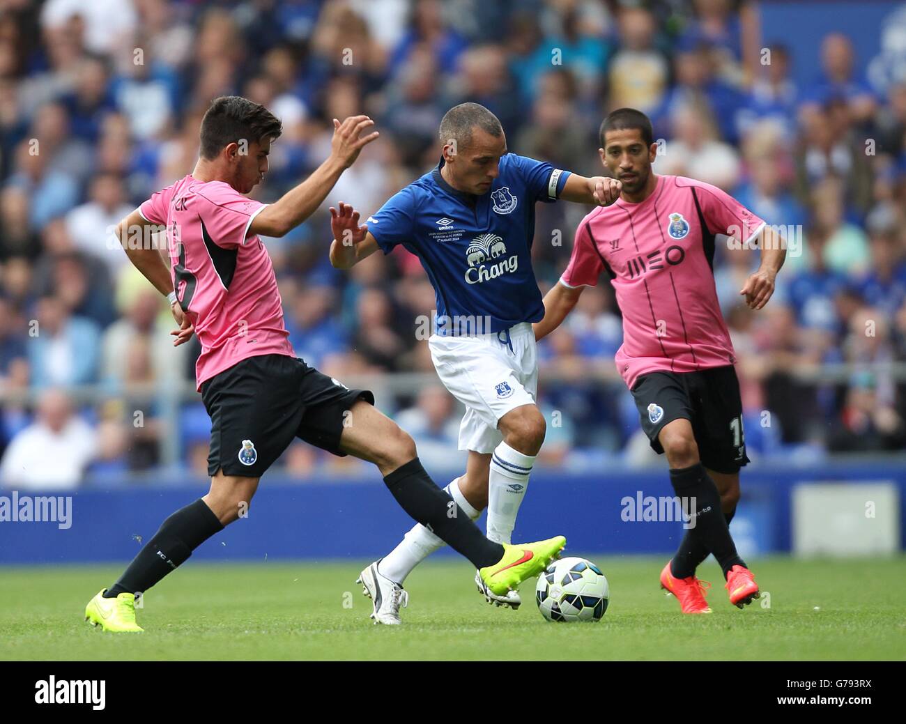 Everton's Leon Osman battles for the ball with FC Porto's Evandro ...