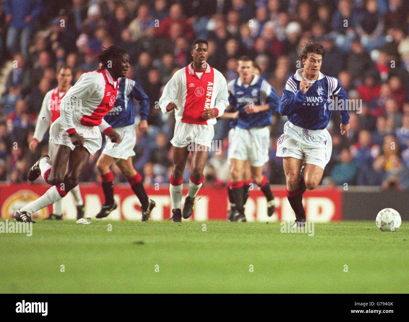 Mario Melchiot, Ajax Amsterdam (left) and Brian Laudrup, Glasgow ...