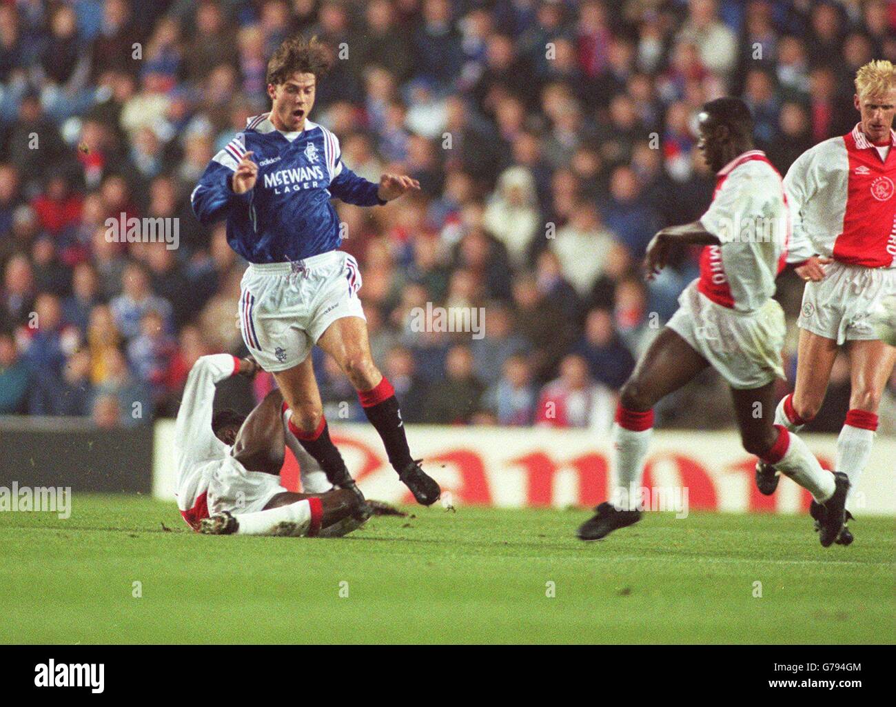 Mario Melchiot, Ajax Amsterdam tackles Brian Laudrup, Glasgow Rangers ...
