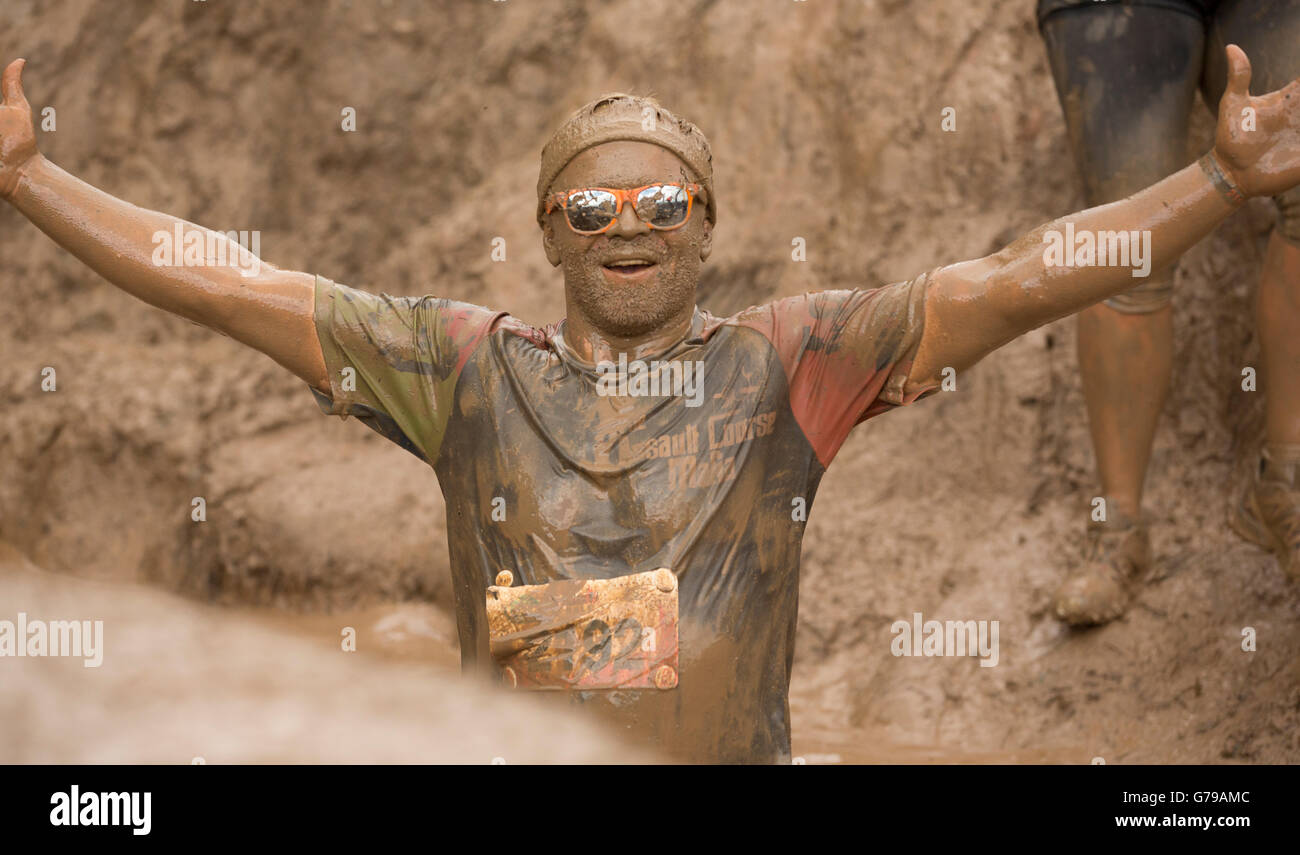 Man mud glorious mud on the Mud Mile obstacle at Tough Mudder at ...