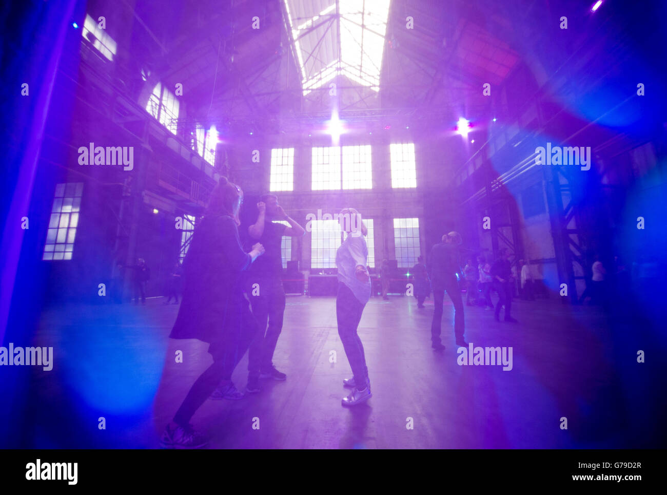 Essen, Germany. 25th June, 2016. Visitors wearing headphones dance ...