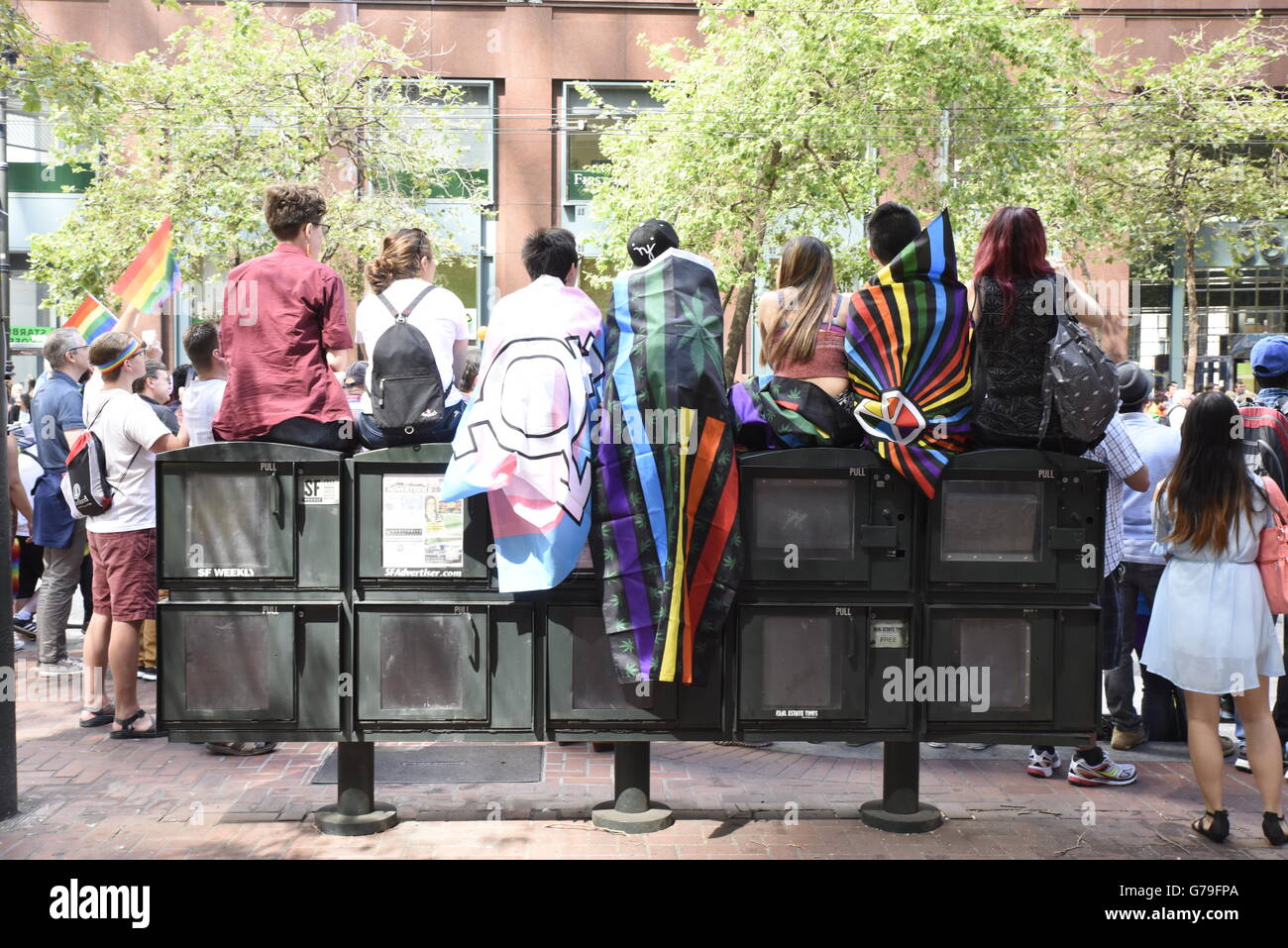 During the 46th annual San Francisco LGBT Pride Parade, people sit on ...