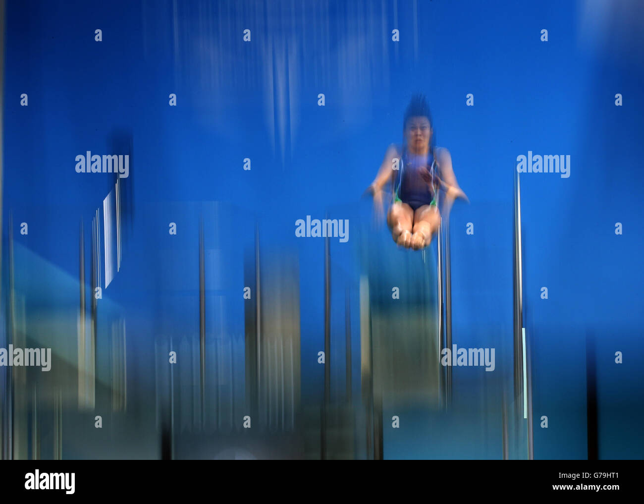 A competitor dives in the Diving Women's 3m Springboard Final at the ...