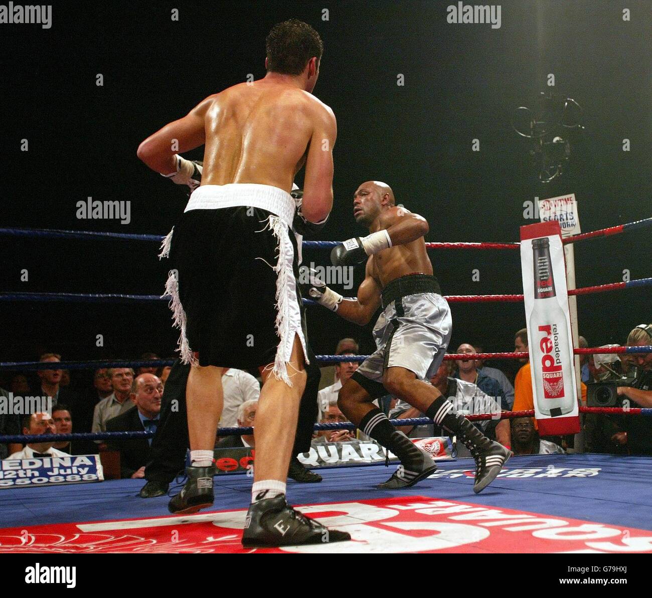 Joe Calzaghe from Wales (L) topples American Byron Mitchell during ...