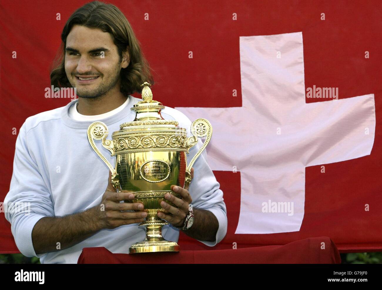 Sport tennis trophy celebrating smiling swiss flag roger federer hi-res stock photography and ...