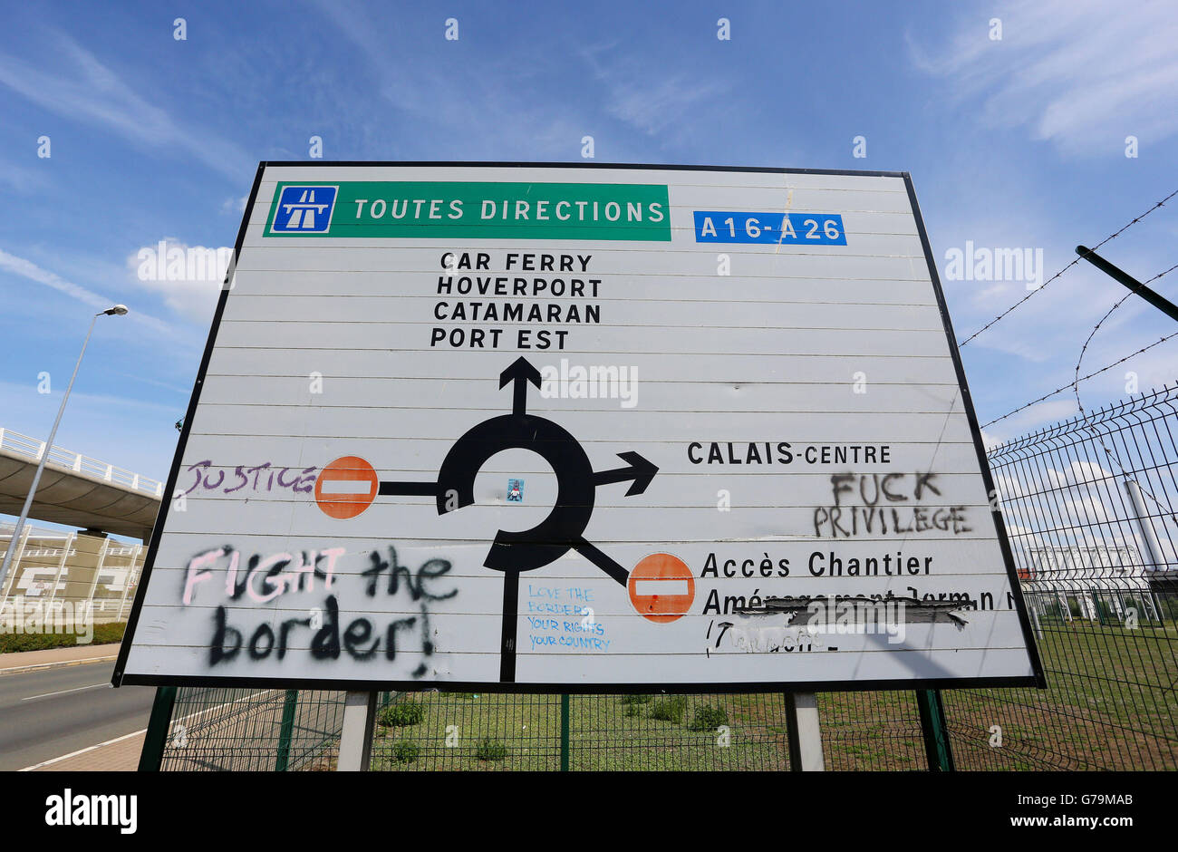 A defaced road sign in Calais, France, as tensions remain high ...