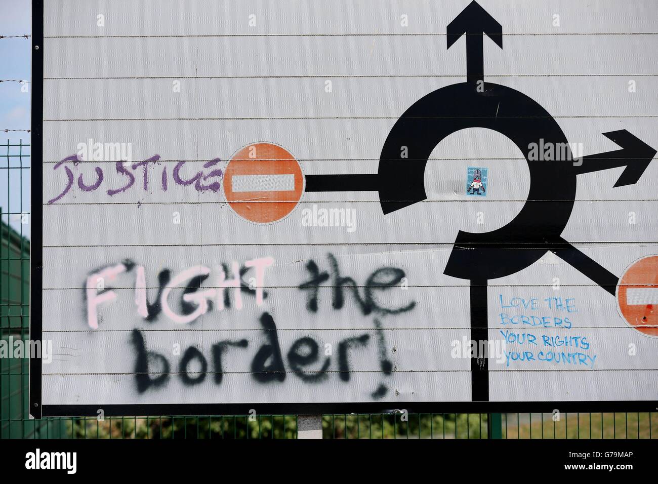 A defaced road sign in calais hi-res stock photography and images - Alamy