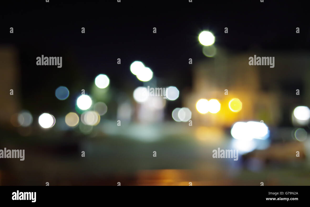 Defocused and blur city night scene with blurred lighting of street ...