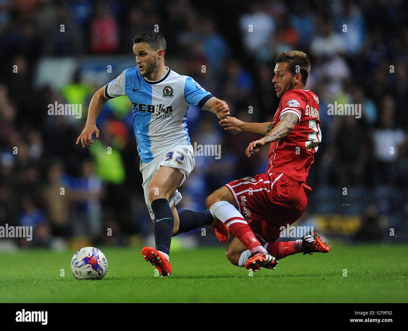 Blackburn Rovers' Craig Conway (left) and Cardiff City's Guido ...