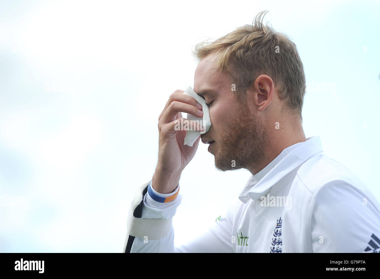 England's Stuart Broad holds his nose after being hit in the face by ...