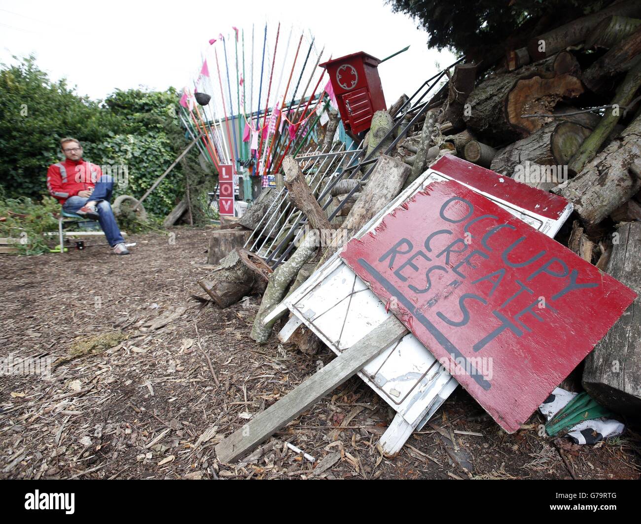 A resident guards entrance to transition heathrow protest squatters ...