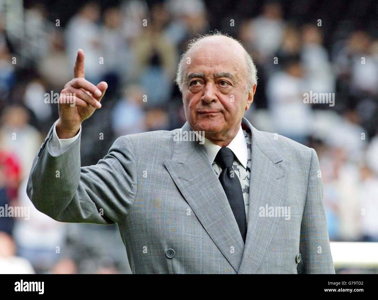 Fulham owner Mohammed Al Fayed on the pitch at Craven Cottage, as his ...
