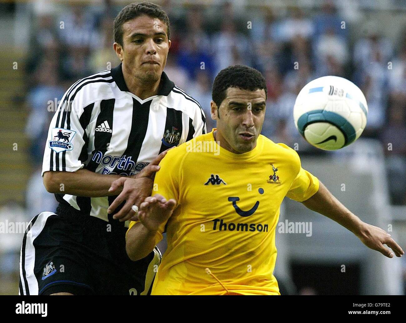 Newcastle's Laurent Robert (L) tussles with Tottenham's Nourredine ...