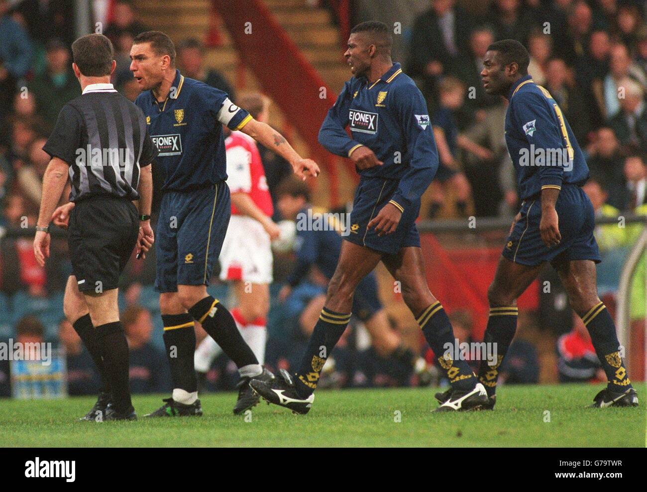 Wimbledon's Vinny Jones and Efan Ekoku protest after penalty wasn't ...