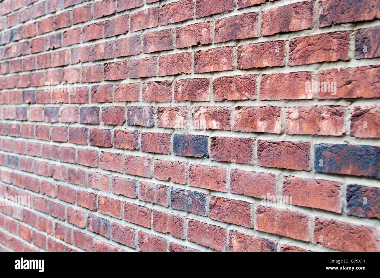 Fragment of brown brick wall with a shallow depth of field, which is ...