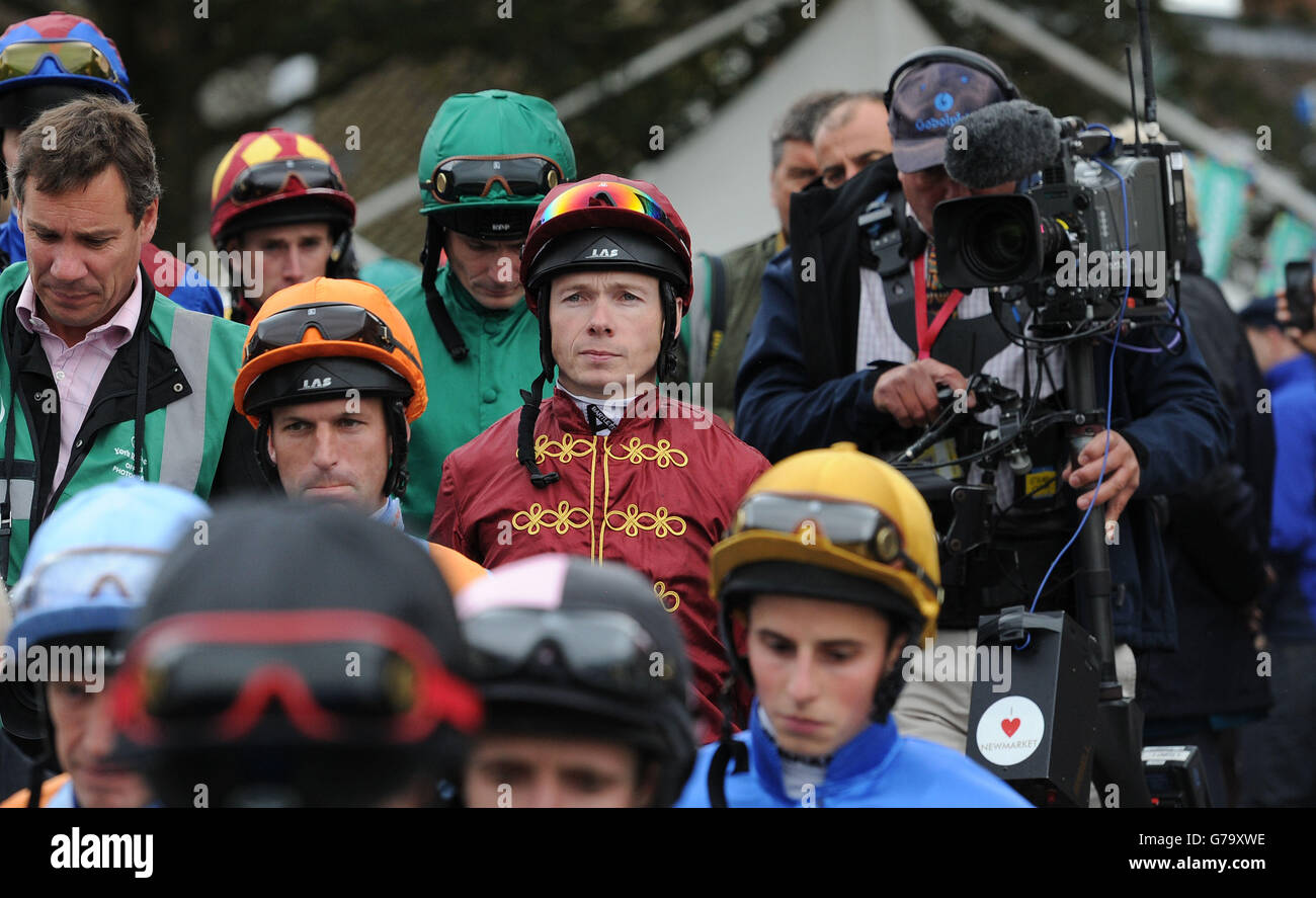 Jockey Jamie Spencer (centre) arrives into the parade ring during Day ...