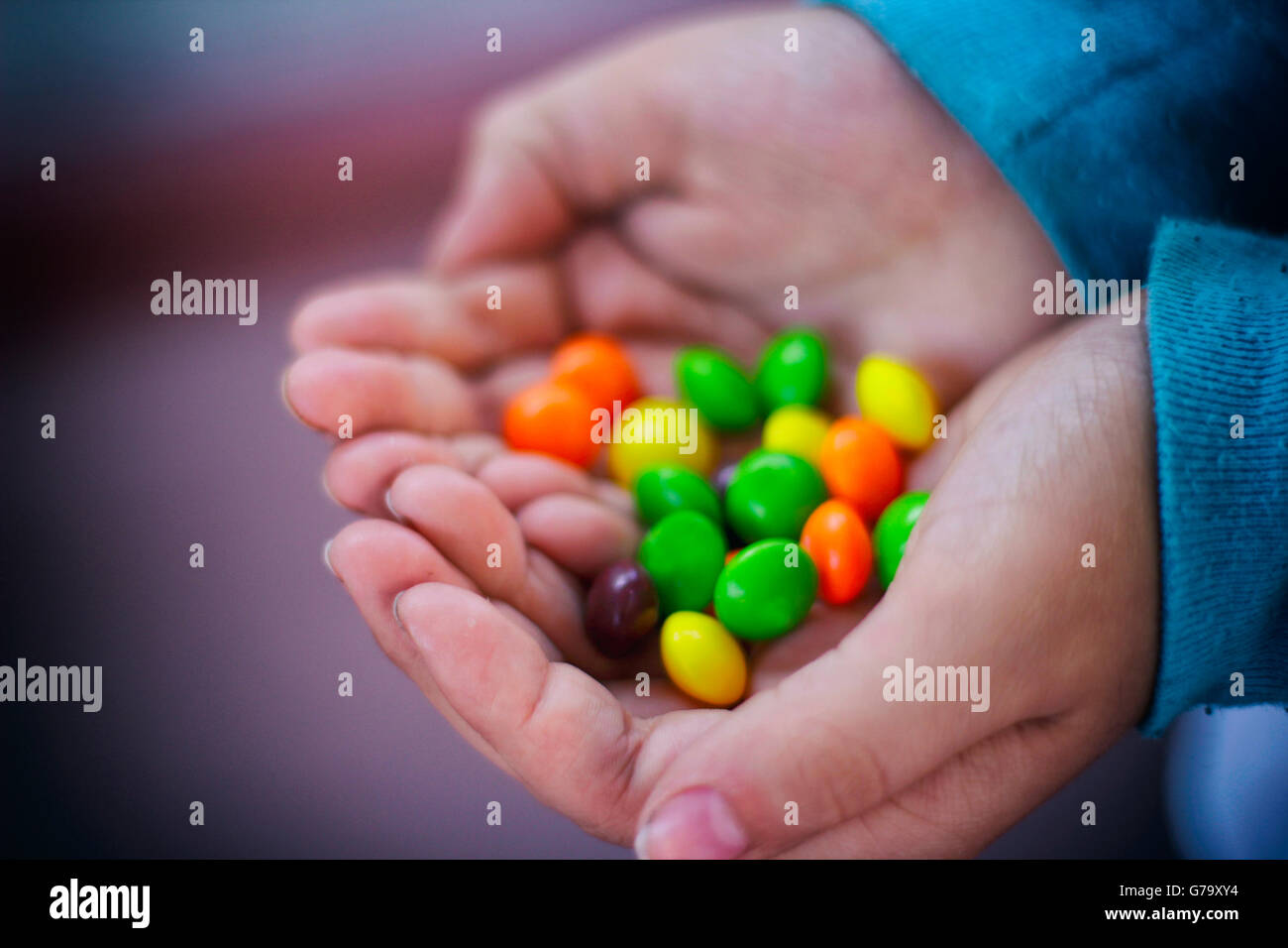 Hands holding candy hi-res stock photography and images - Alamy