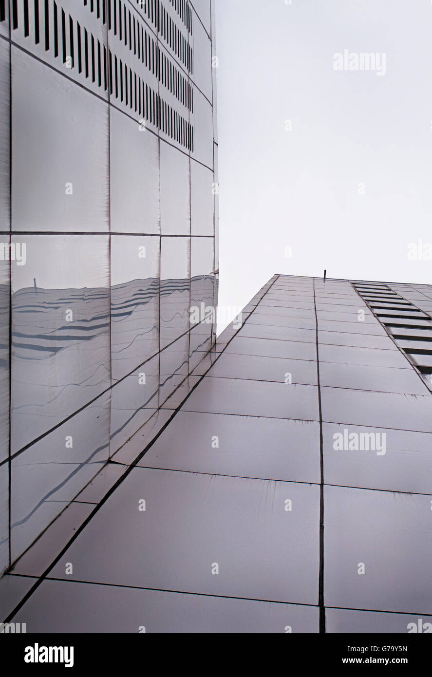 Photograph of a pair of metal buildings from a bottom perspective Stock ...