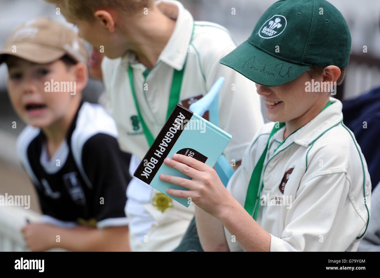 Surrey fans wait for player autographs with their autograph books Stock ...