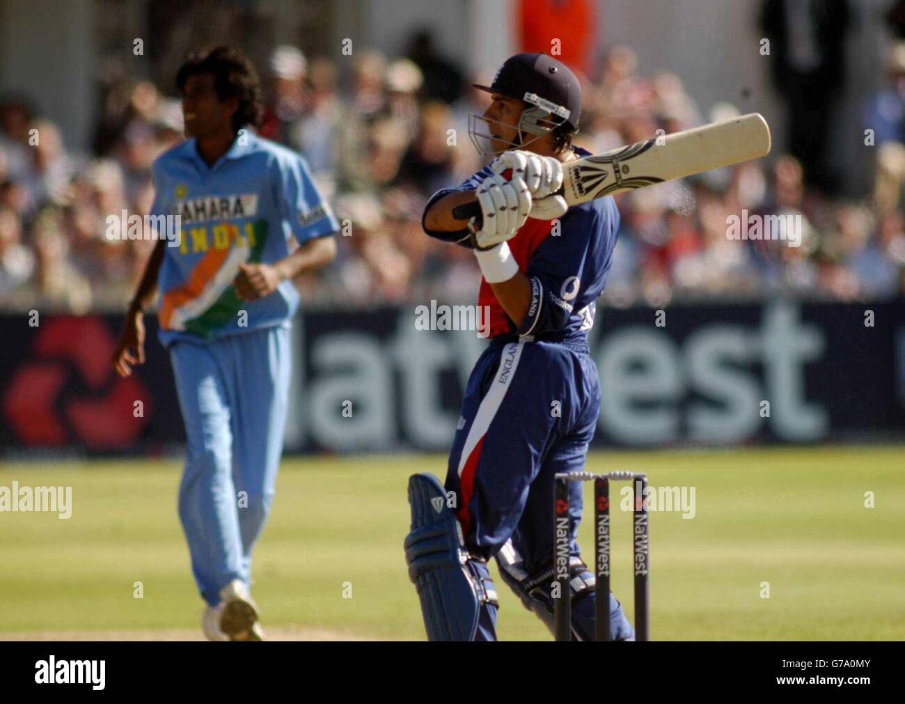 England's Vikram Solanki hits a boundary off India's Lakshmipathy ...