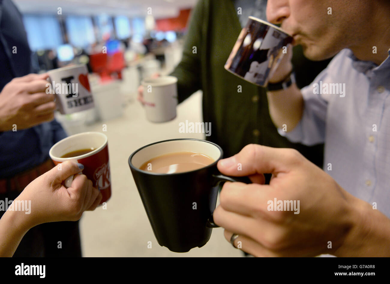 Office workers drink tea and coffee, London Stock Photo - Alamy