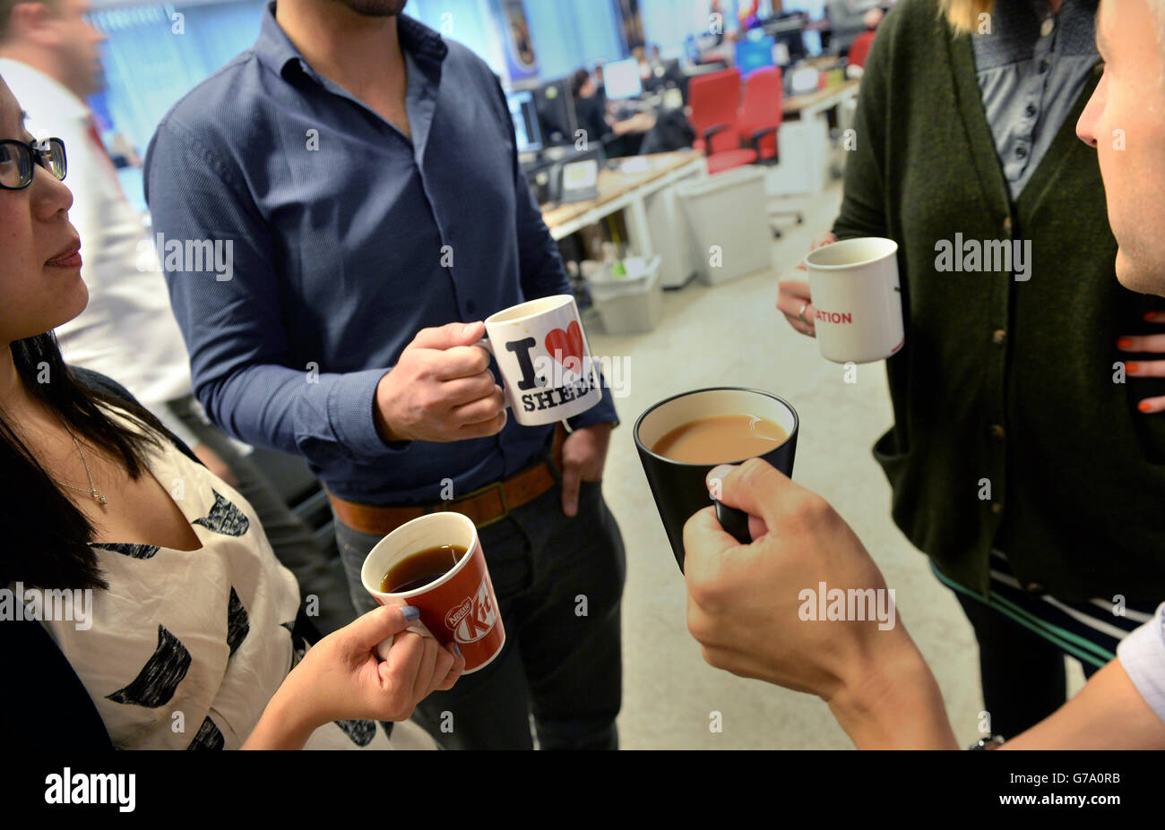 Office workers drink tea and coffee, London Stock Photo - Alamy
