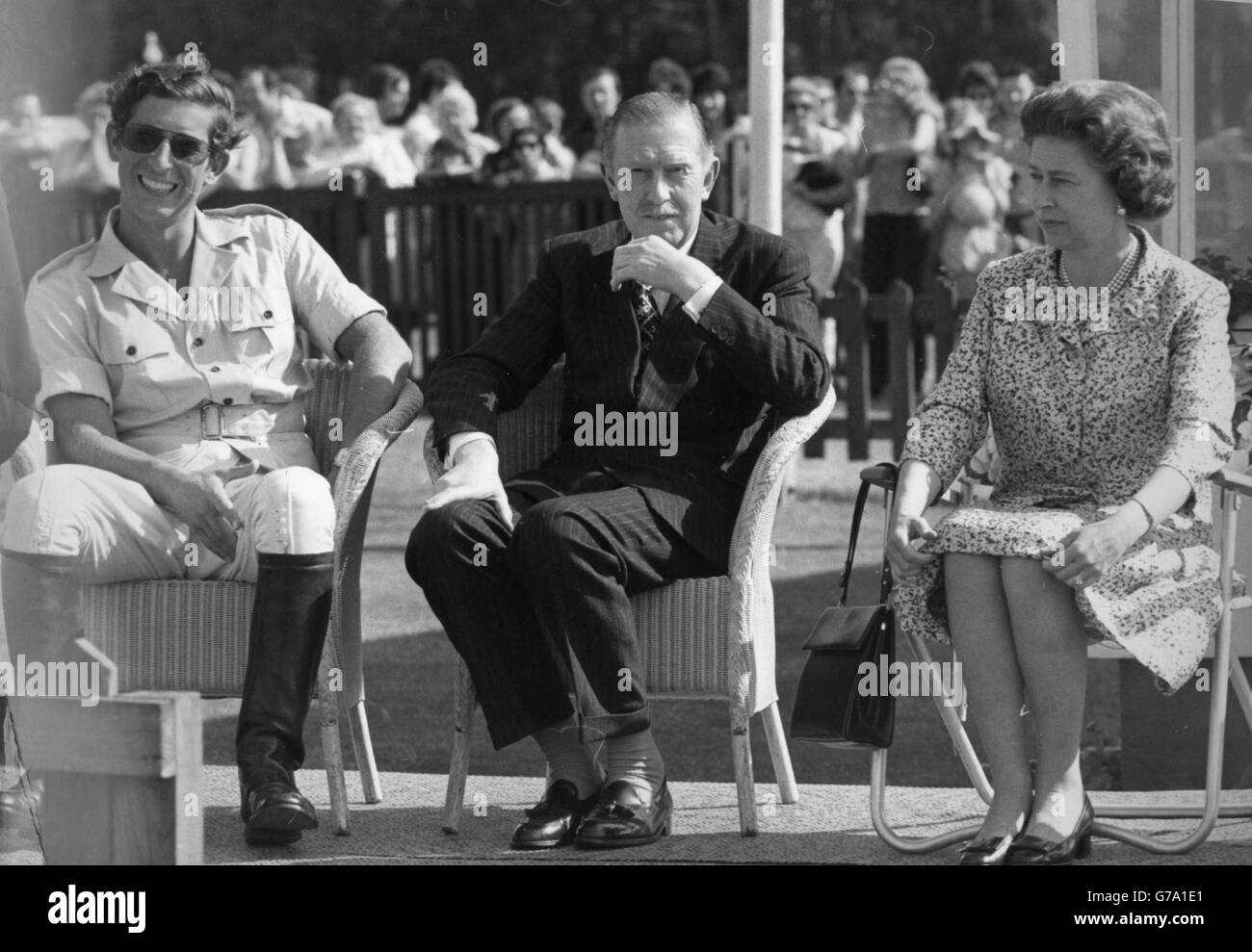 Prince Charles (left) watches polo with the Crown Equerry Lt Col Sir ...