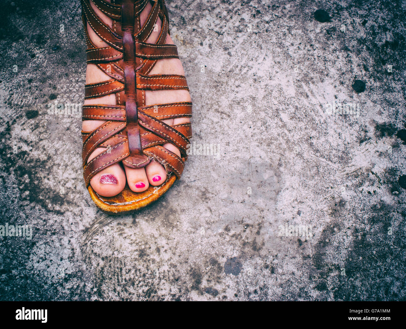 Photograph of a womans foot with a sandal Stock Photo - Alamy