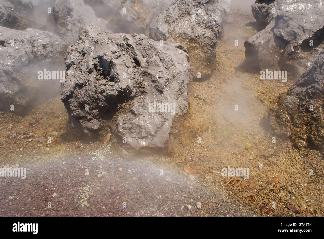 Photograph of some steaming rocks or stones Stock Photo - Alamy