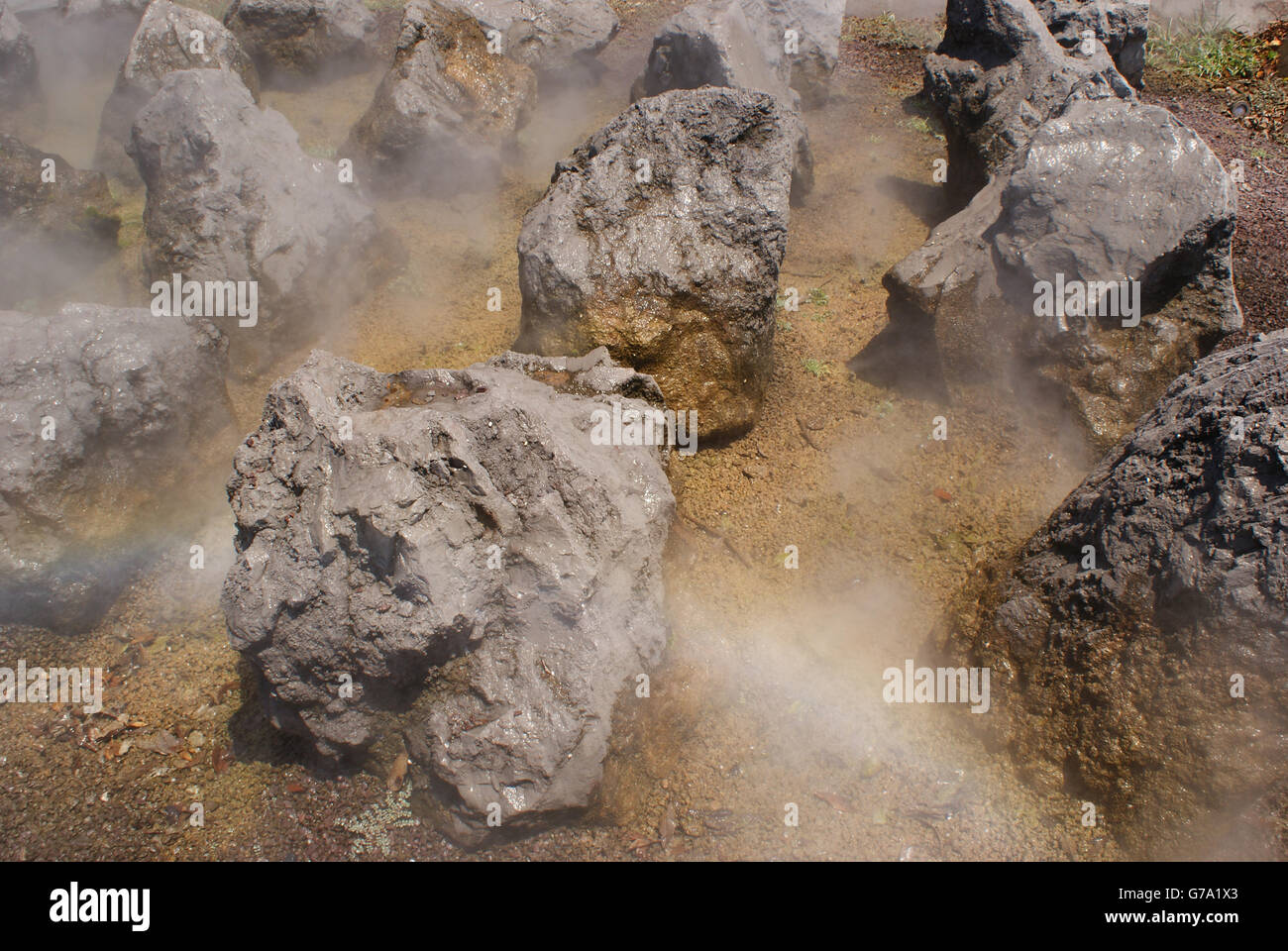 Photograph of some steaming rocks or stones Stock Photo - Alamy