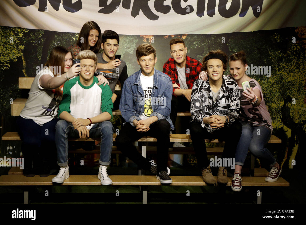 One Direction wax figures make over Stock Photo - Alamy