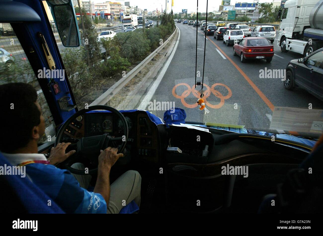 An official Olympic bus makes its way along a special Olympic bus lane ...