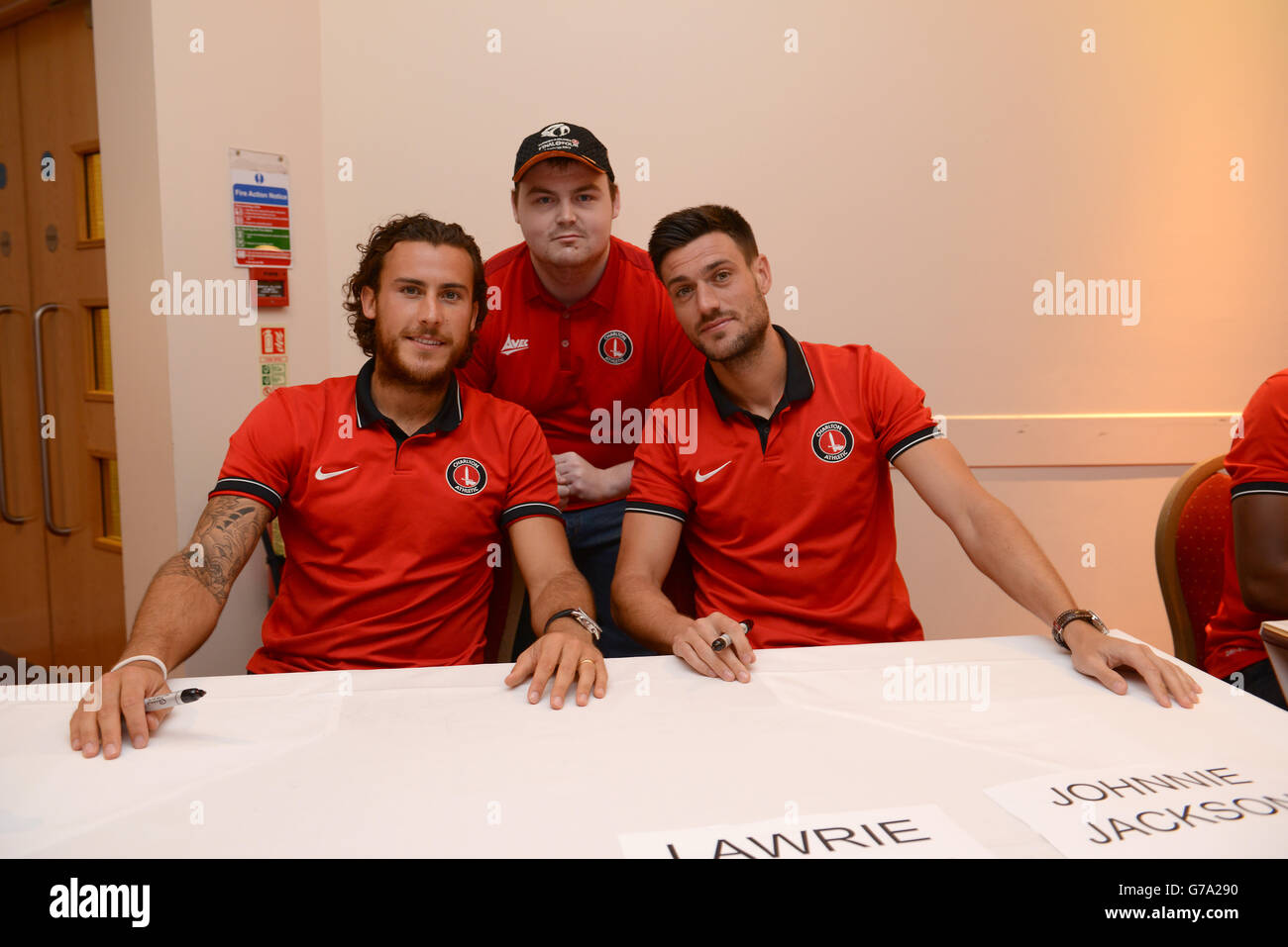 A fan poses for a photograph with Charlton Athletic's Lawrie Wilson and ...