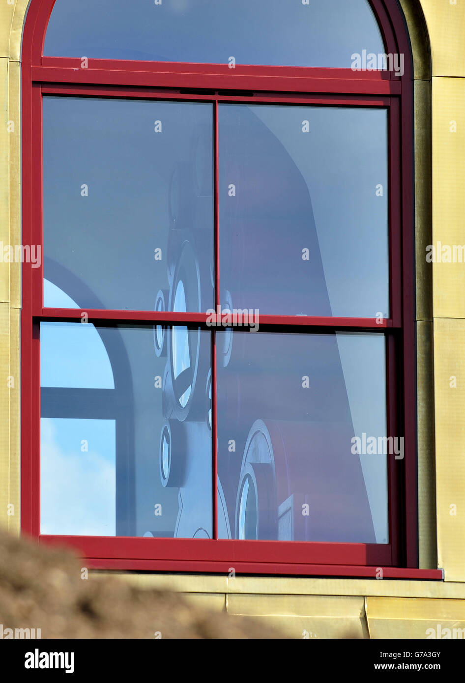 A view of round mirrors on a wall through an upstairs window of 'Home ...