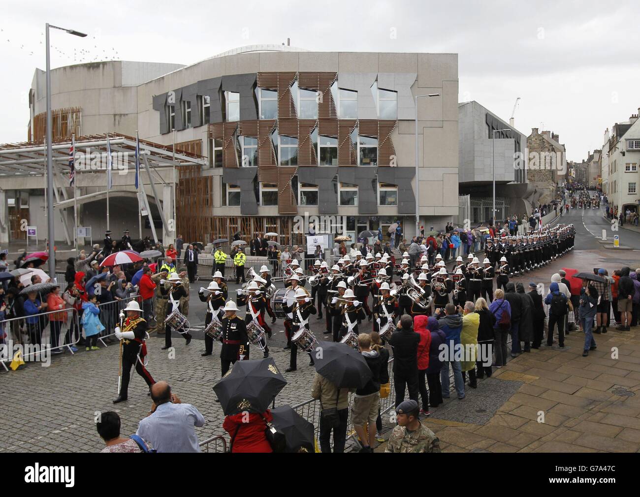 A parade passes the Scottish Parliament in Edinburgh following the ...