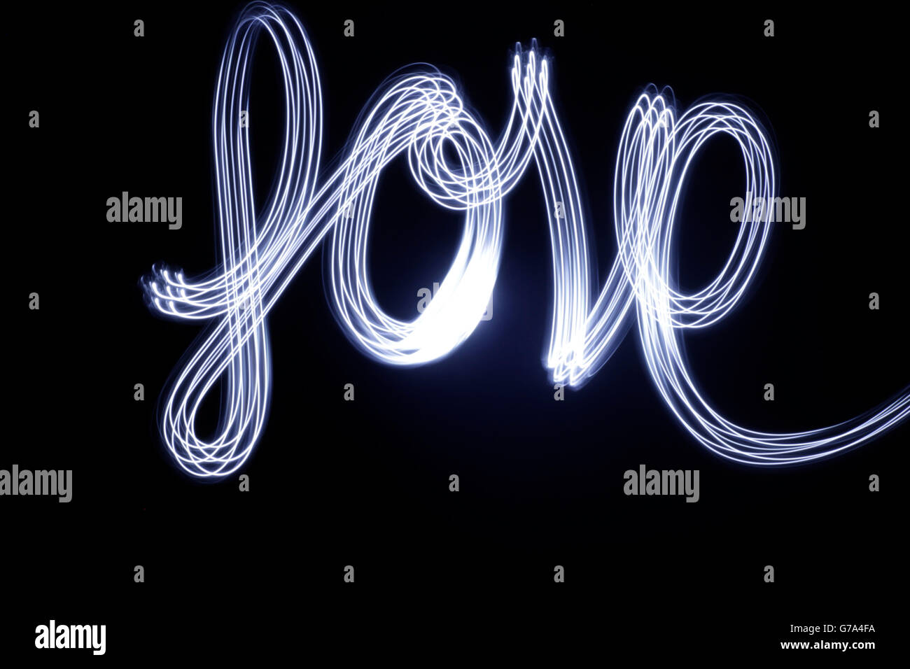 Photograph of a light drawing of the word Love with a long exposure ...
