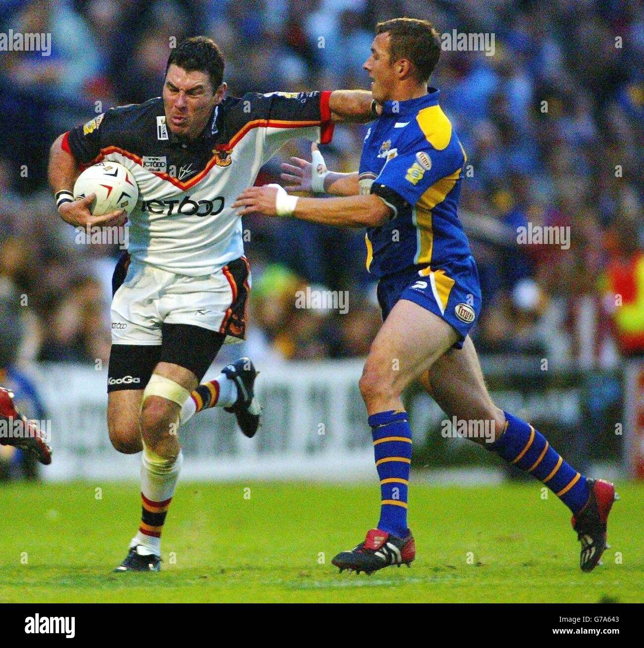 Bradford Bulls's Michael Withers hands off Leeds' Danny McGuire during ...